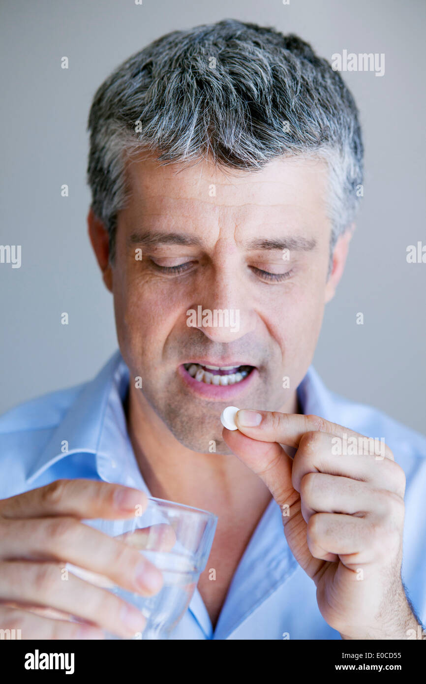 Taking medication pill hi-res stock photography and images - Alamy