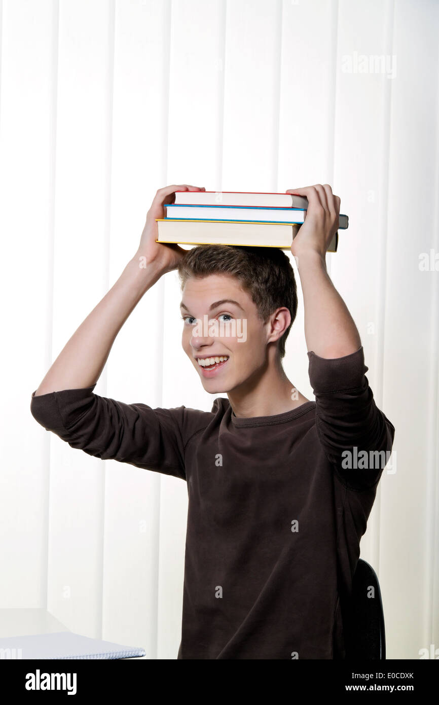 A young student with learn with books, Ein junger Student beim lernen ...