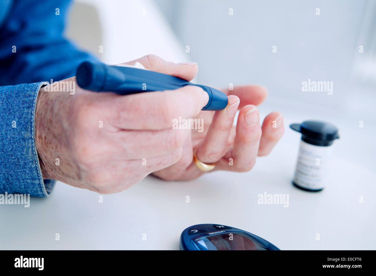 Elderly blood glucose test hi-res stock photography and images - Alamy