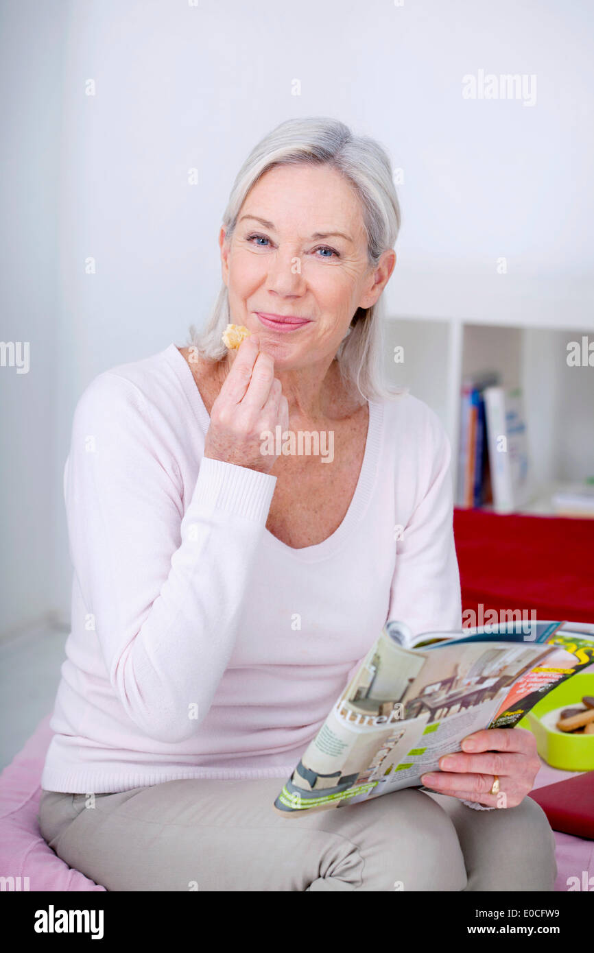Elderly person eating sweets Stock Photo - Alamy