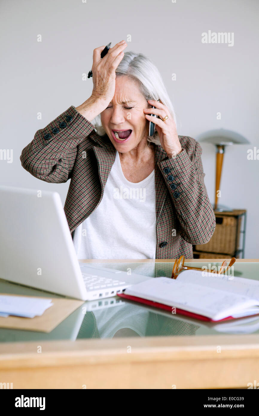 Elderly person teleworking Stock Photo - Alamy