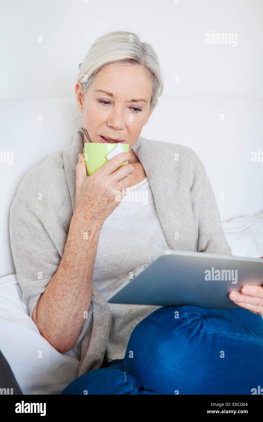 Elderly person with tablet Stock Photo - Alamy