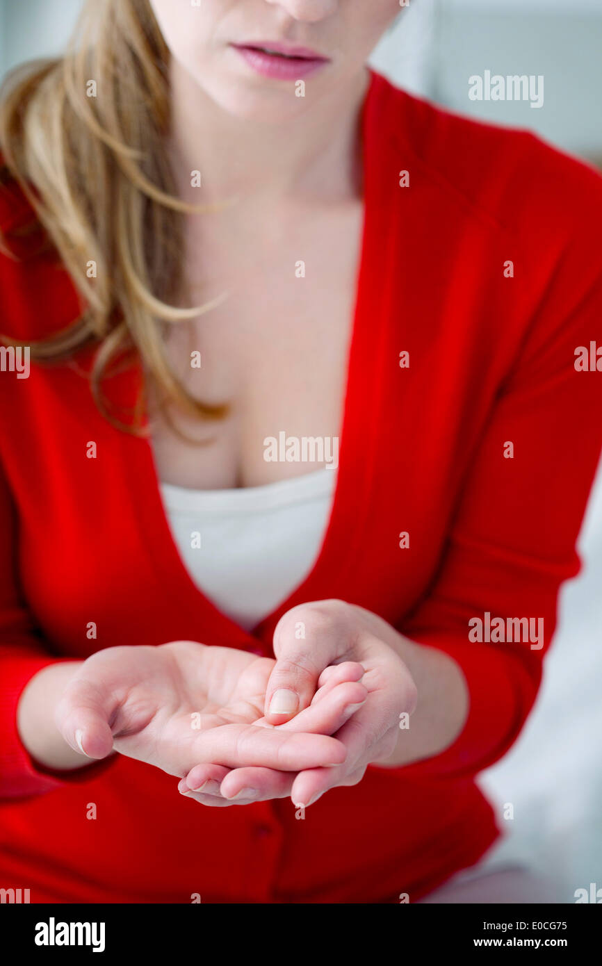 Woman with painful hand Stock Photo - Alamy