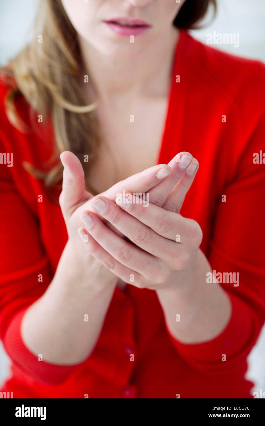 Woman with painful hand Stock Photo - Alamy