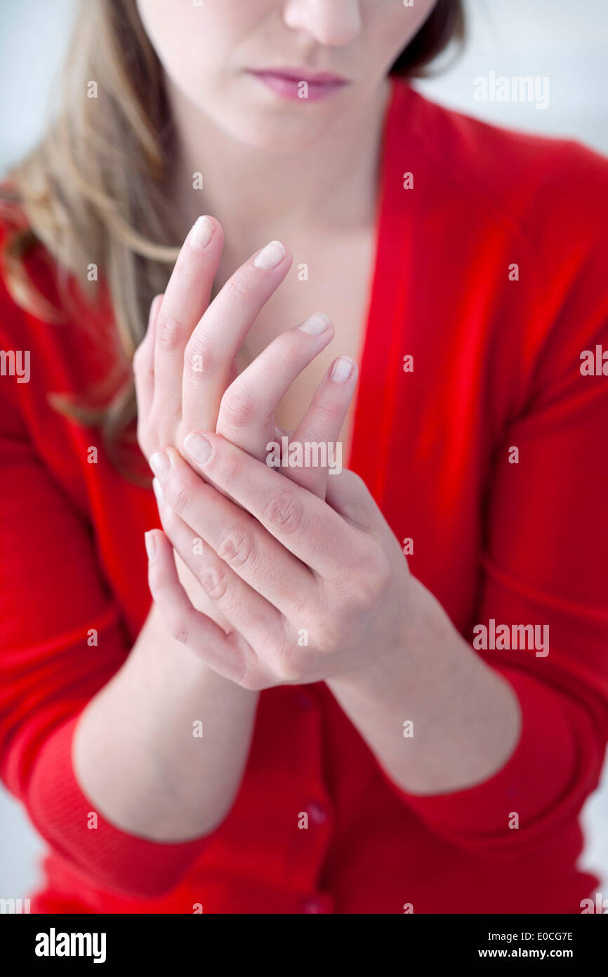 Woman with painful hand Stock Photo - Alamy