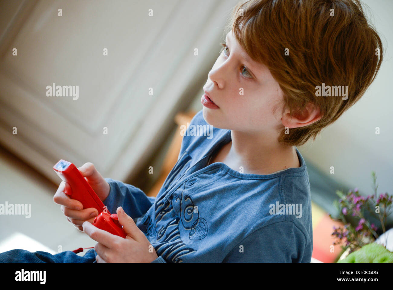 Child playing with video game Stock Photo - Alamy