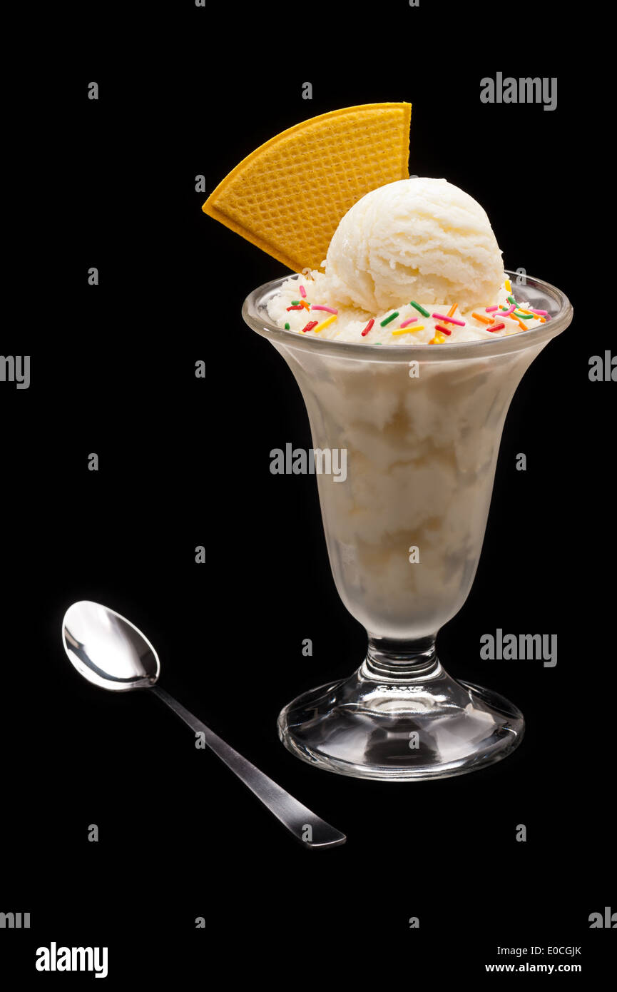 Vanilla Ice cream cup with wafer over black background Stock Photo - Alamy