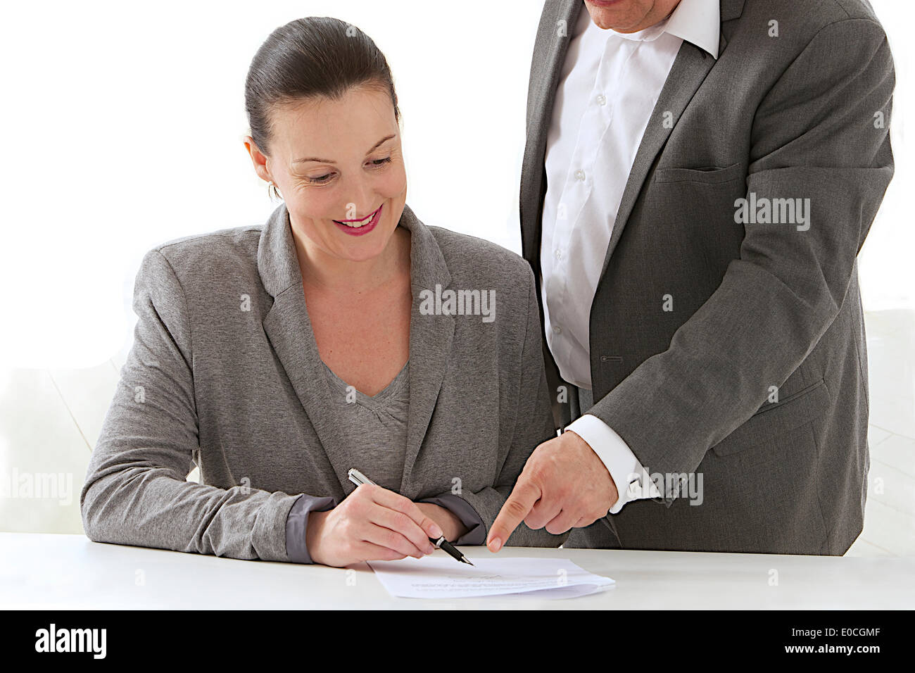 Elderly man signing papers hi-res stock photography and images - Alamy