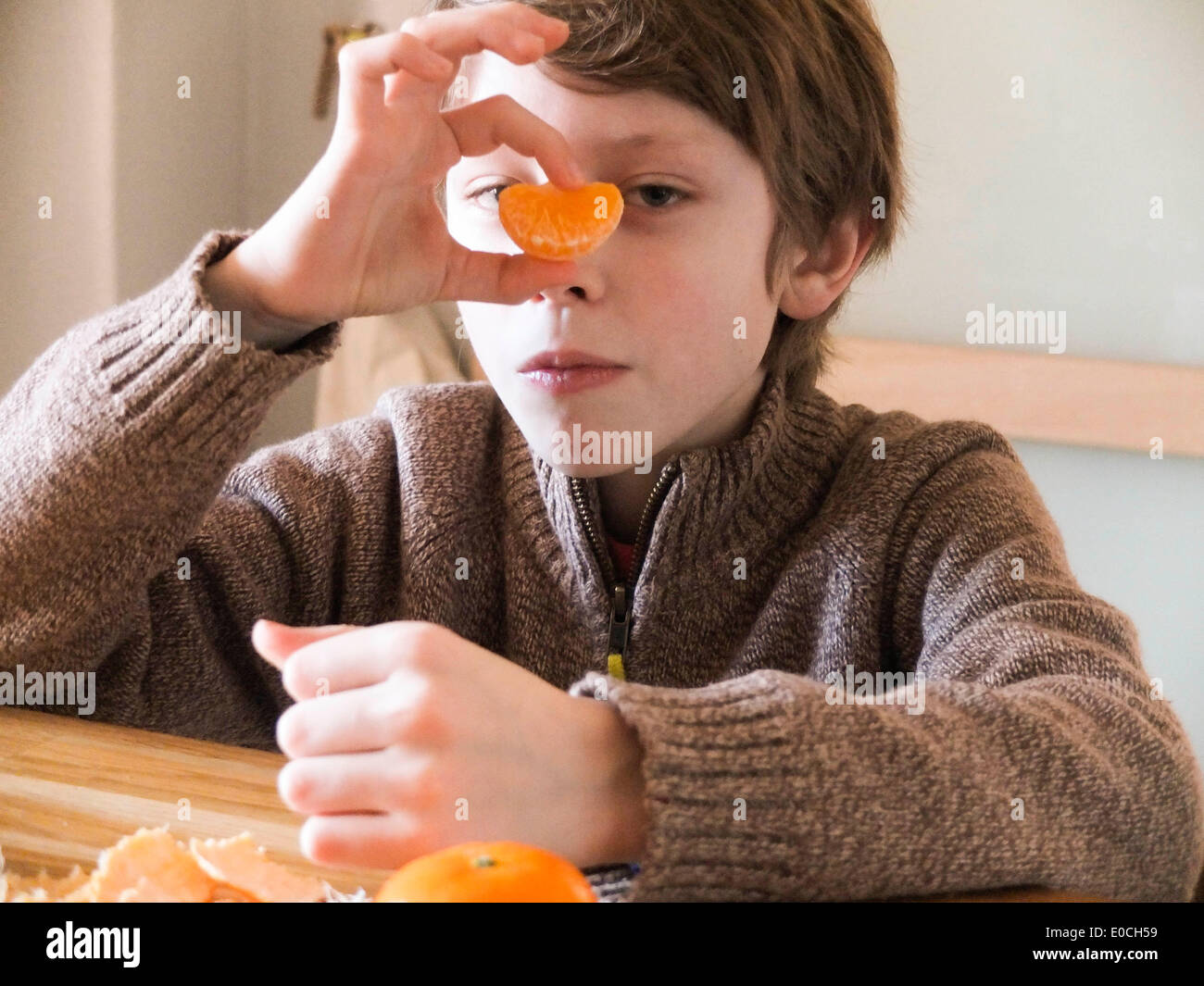 Child eating fruit Stock Photo - Alamy
