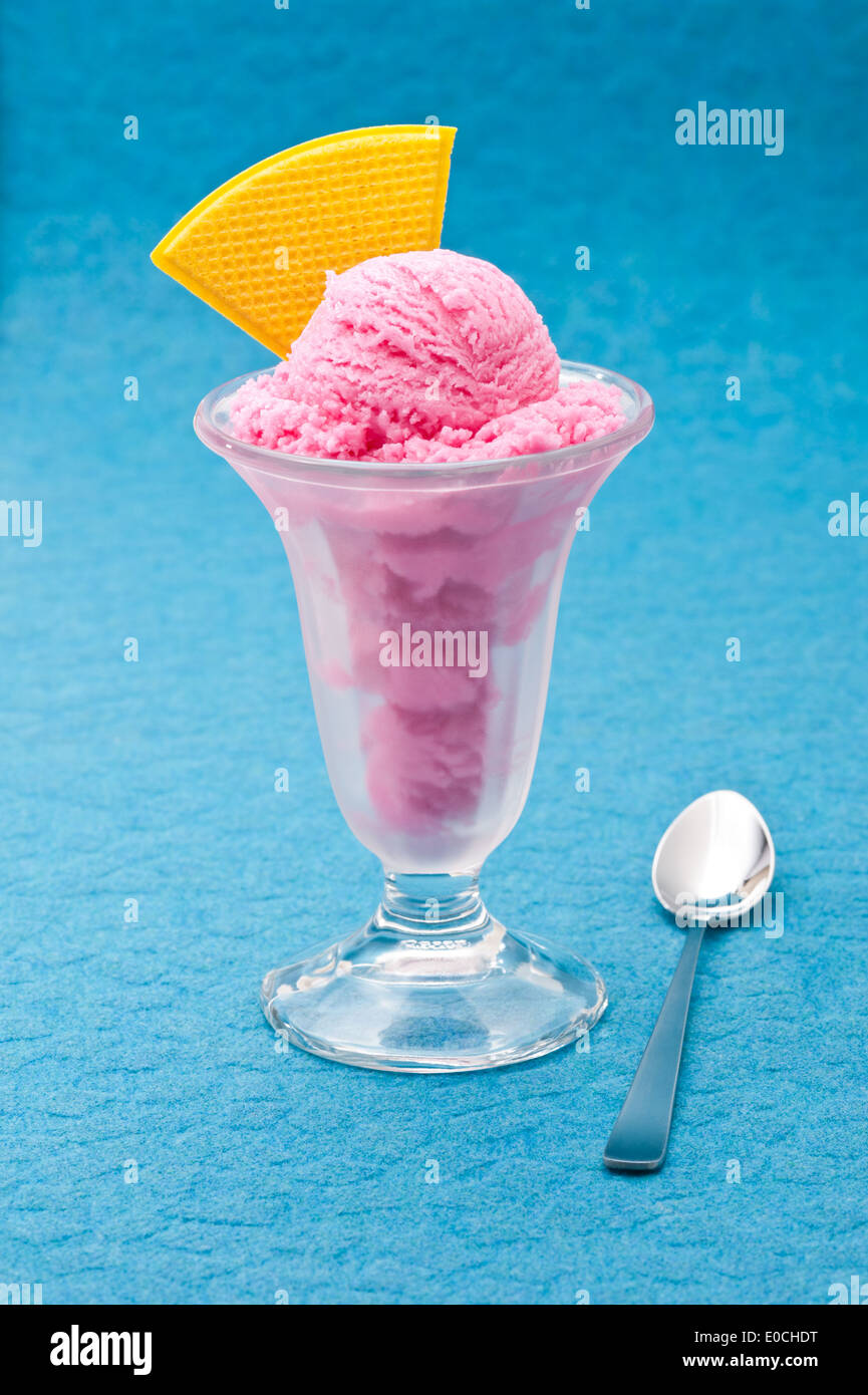 Strawberry ice cream cup with wafer over blue background Stock Photo ...