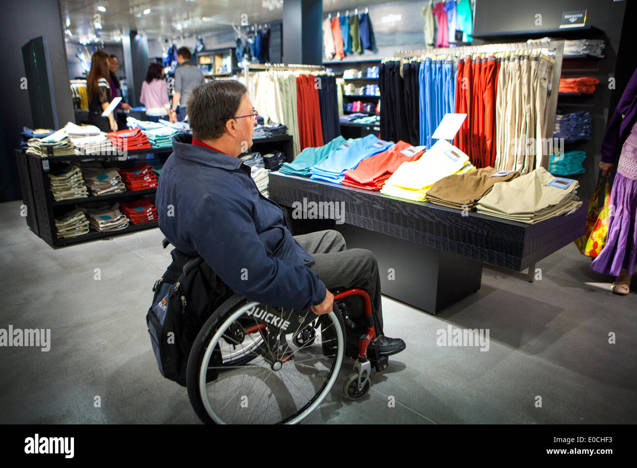 Disabled wheelchair shops shopping hi-res stock photography and images ...
