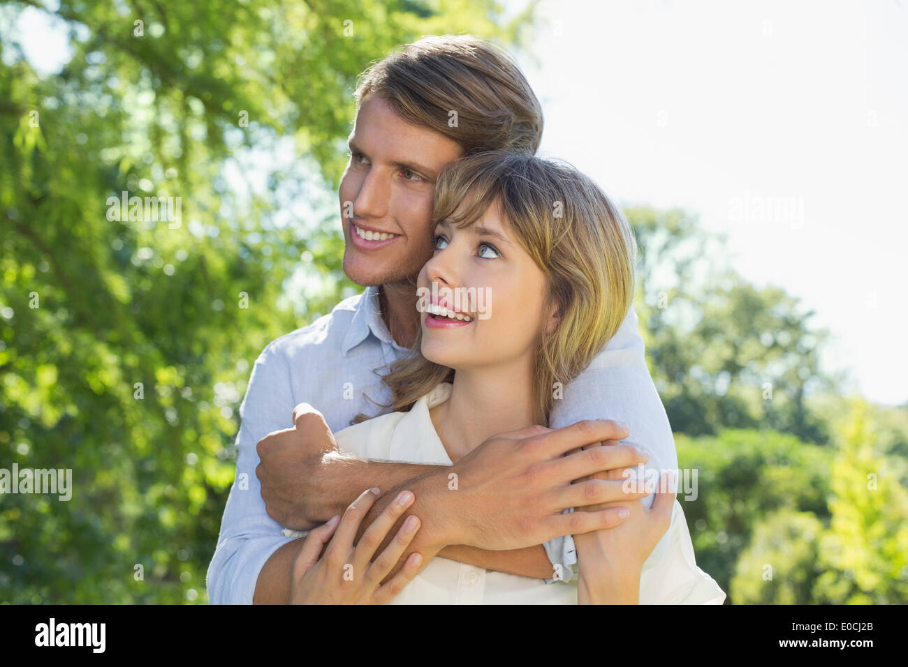 Stylish couple standing cuddling hi-res stock photography and images ...