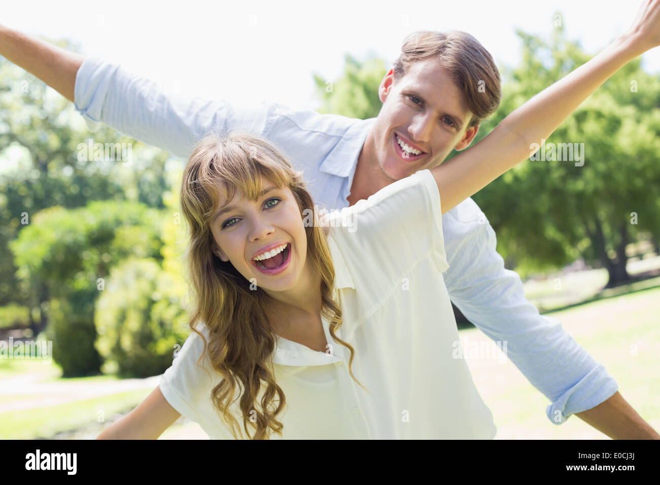 Smiling spreading arms hi-res stock photography and images - Alamy