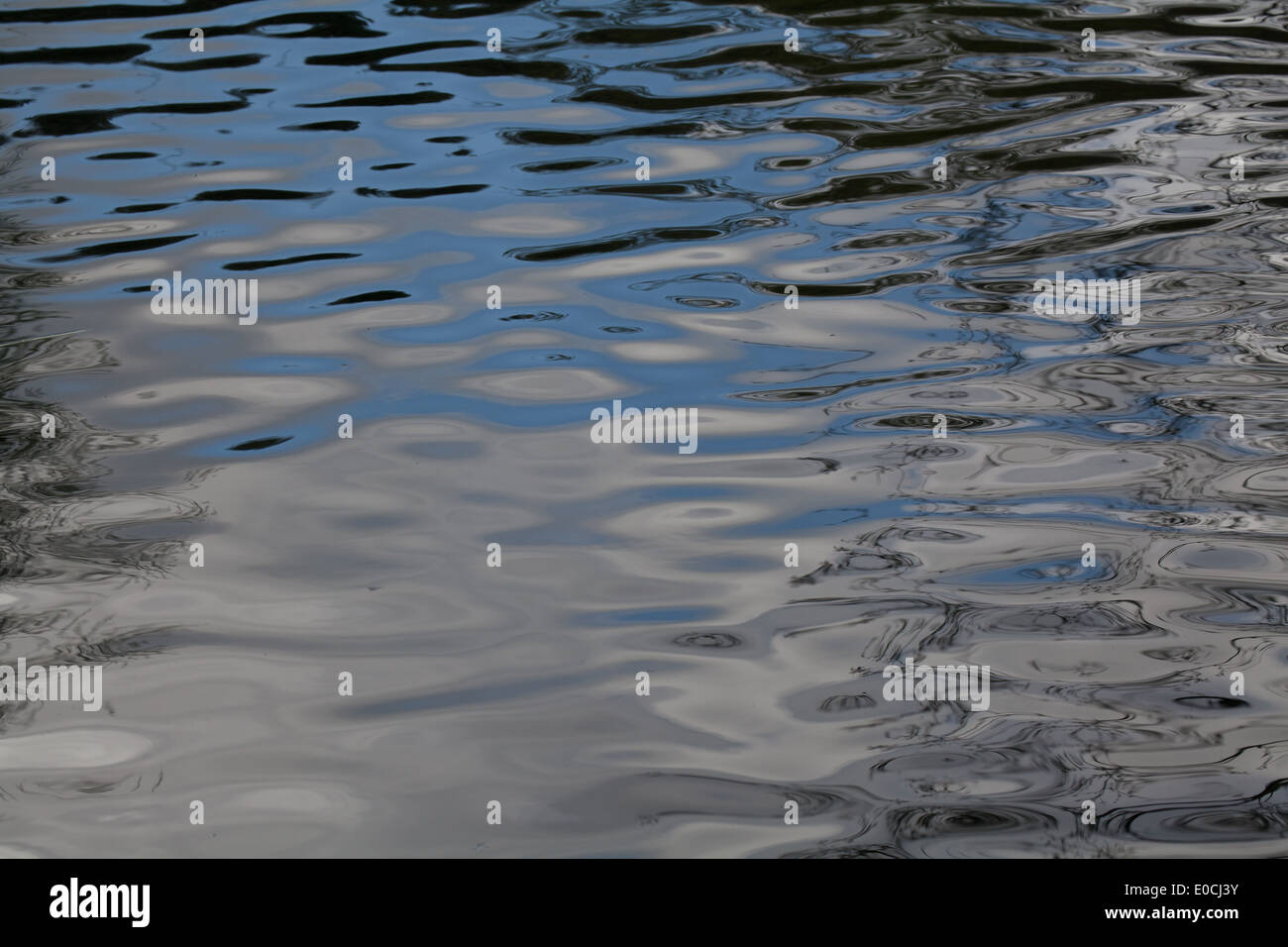 water ripples reflected on water in shades of blue and grey Stock Photo ...