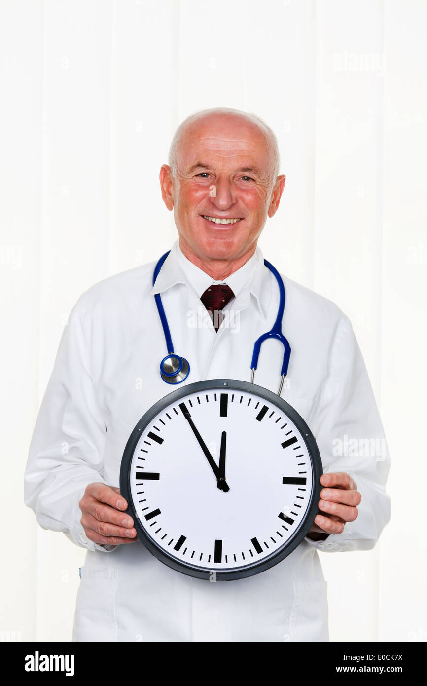 A doctor holds a clock Stock Photo - Alamy