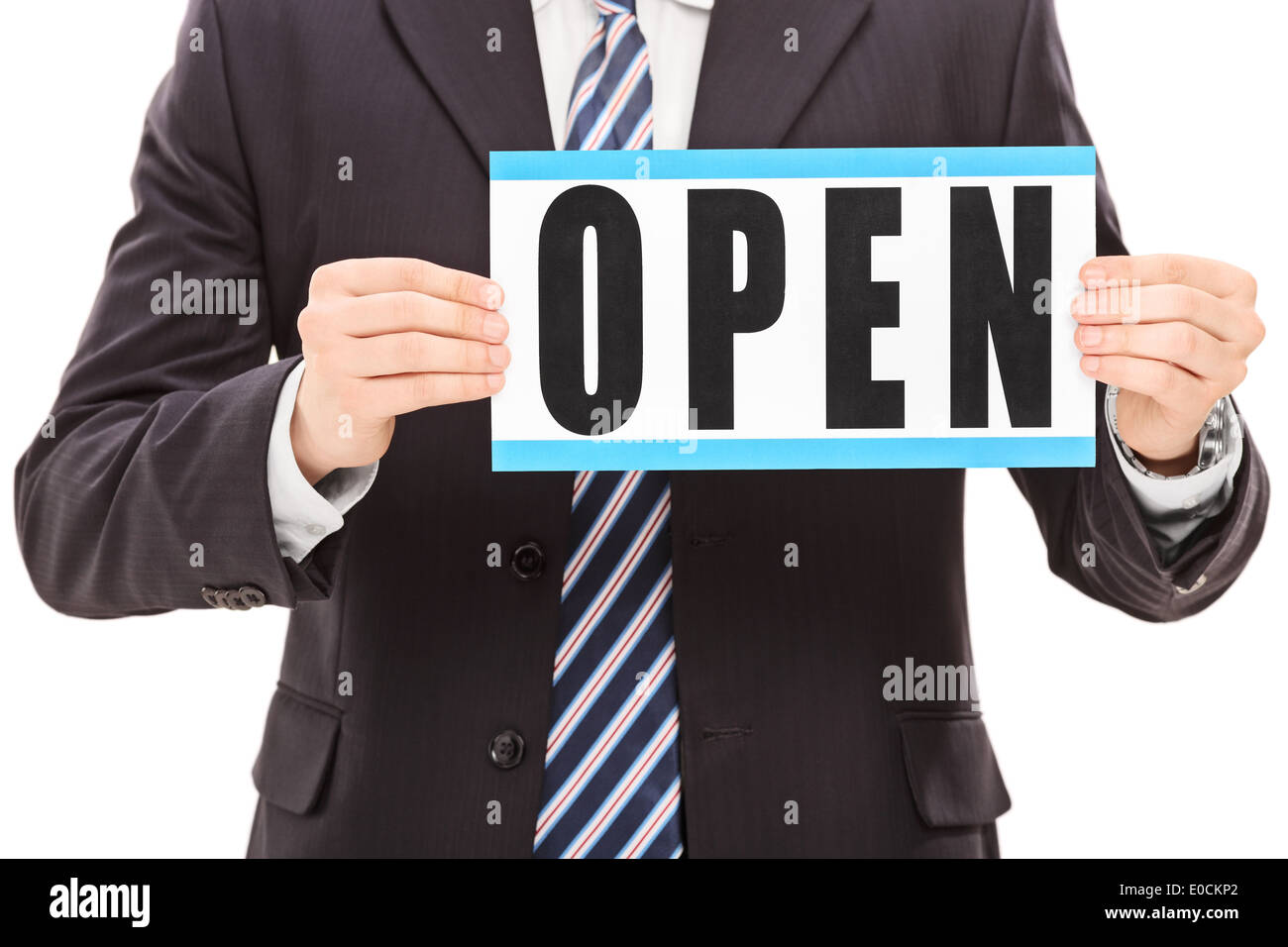 Man in black suit holding an open sign Stock Photo - Alamy