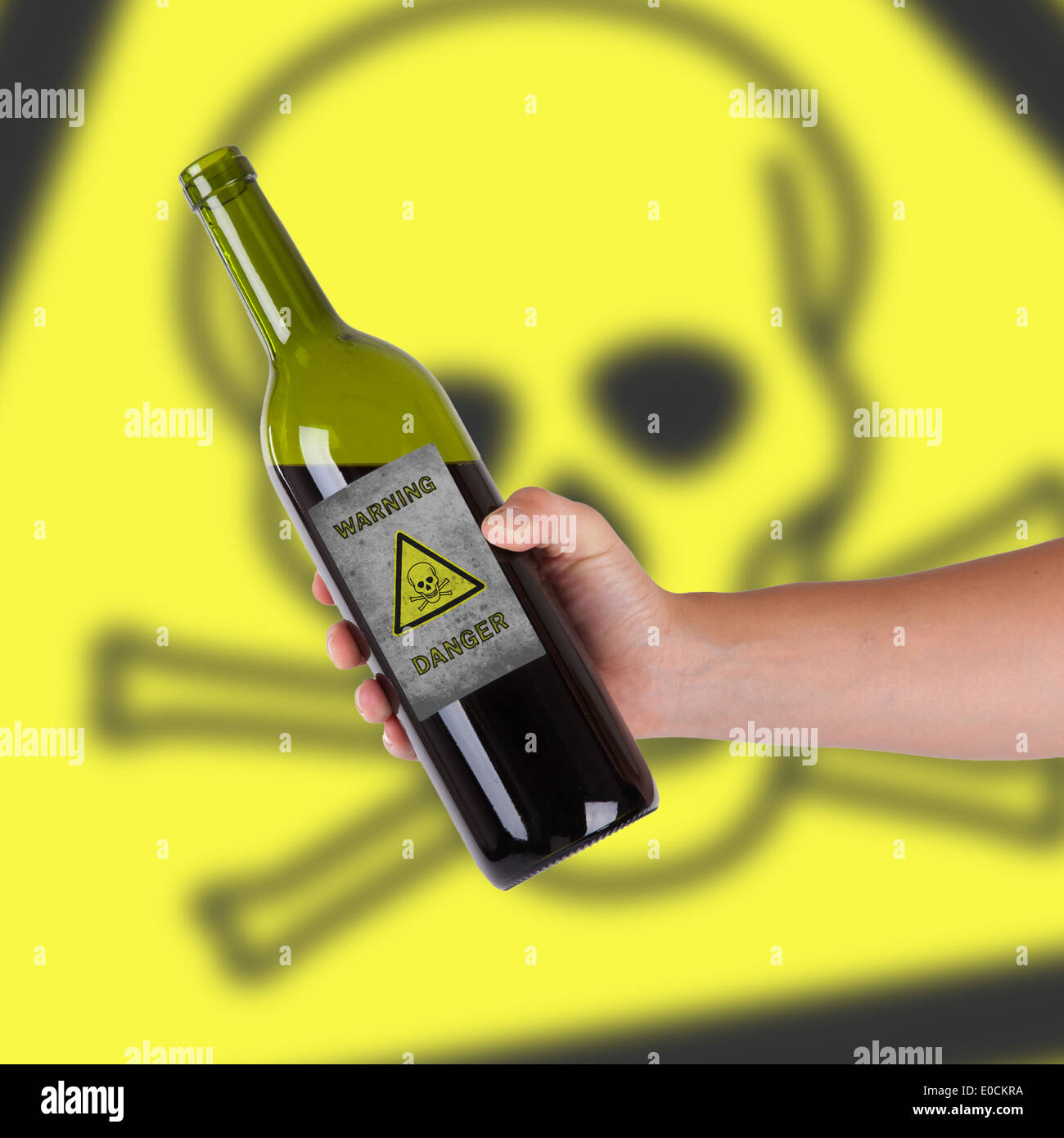 Hand holding bottle warning poison hi-res stock photography and images ...