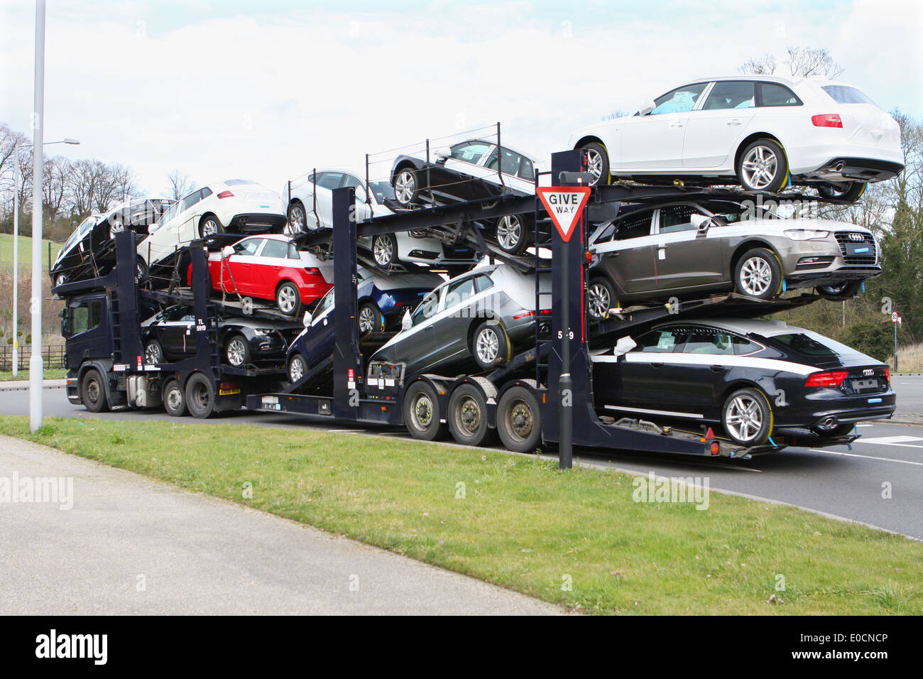 A car transporter carrying a load of new Audi cars and traveling around ...