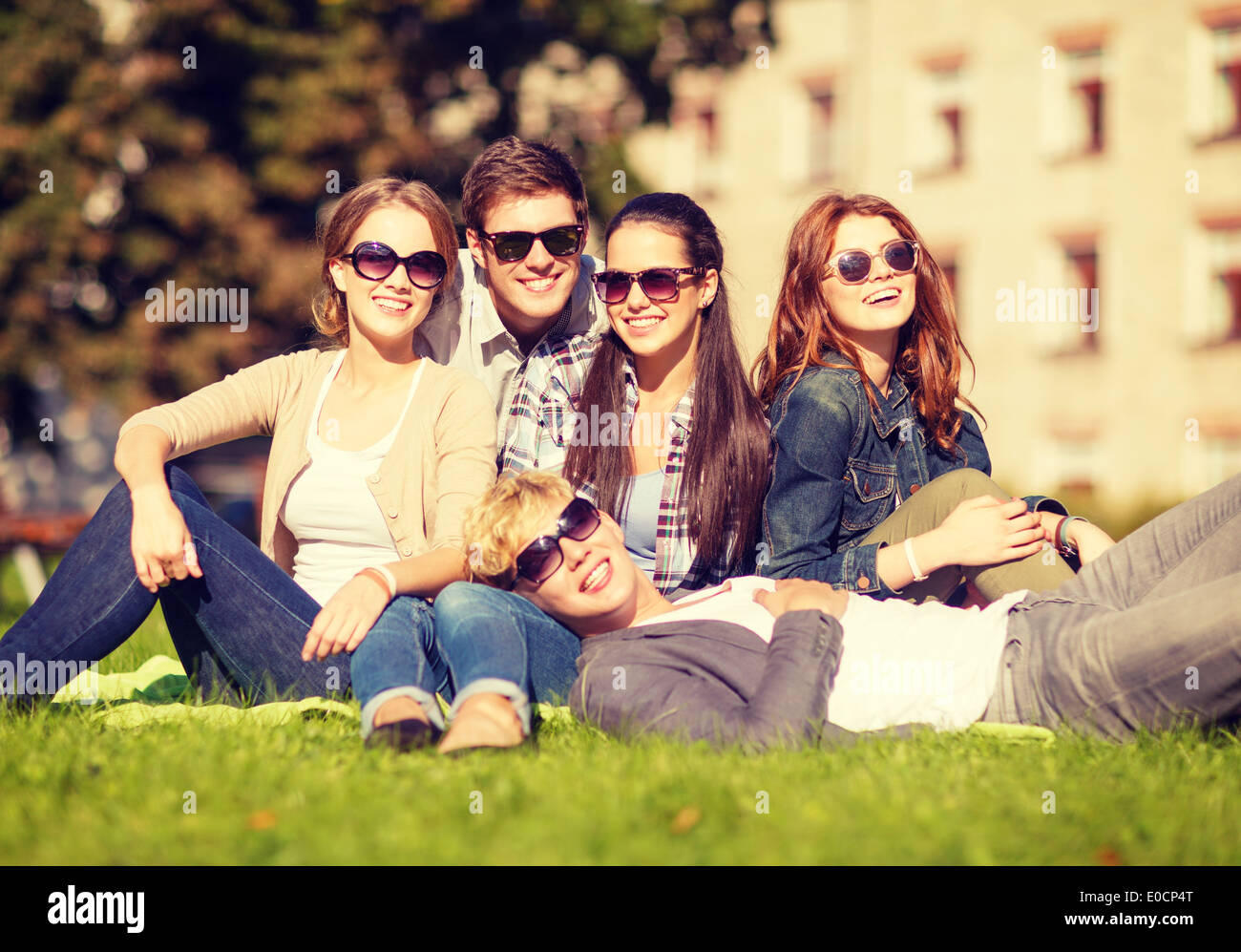 group of students or teenagers hanging out Stock Photo - Alamy