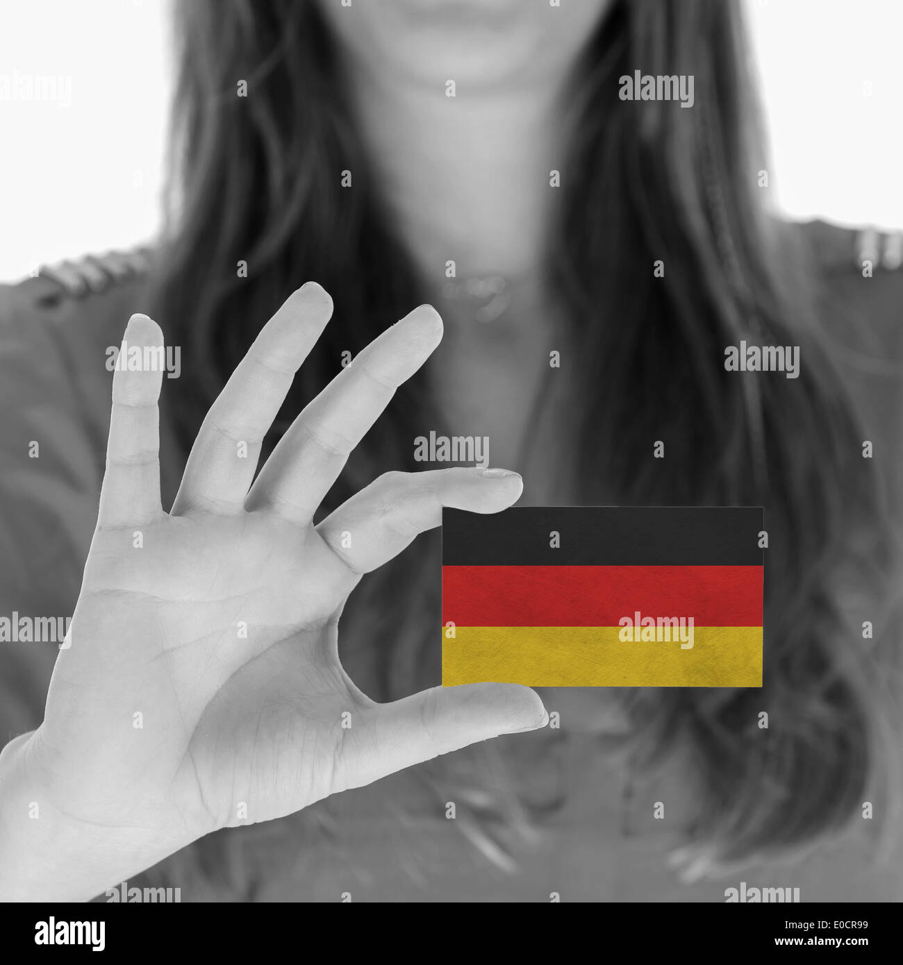 Woman showing a business card black and white Germany Stock Photo - Alamy