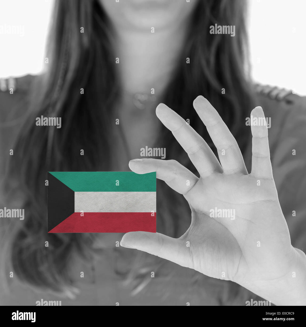 Woman showing a business card black and white Kuwait Stock Photo - Alamy