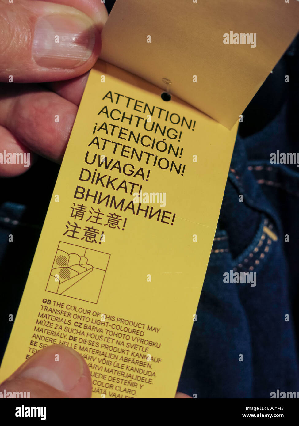 Hand Holding Multilingual Color Safe Clothing Warning Label Stock Photo Alamy hand-holding-multilingual-color-safe-clothing-warning-label-stock-photo-alamy
