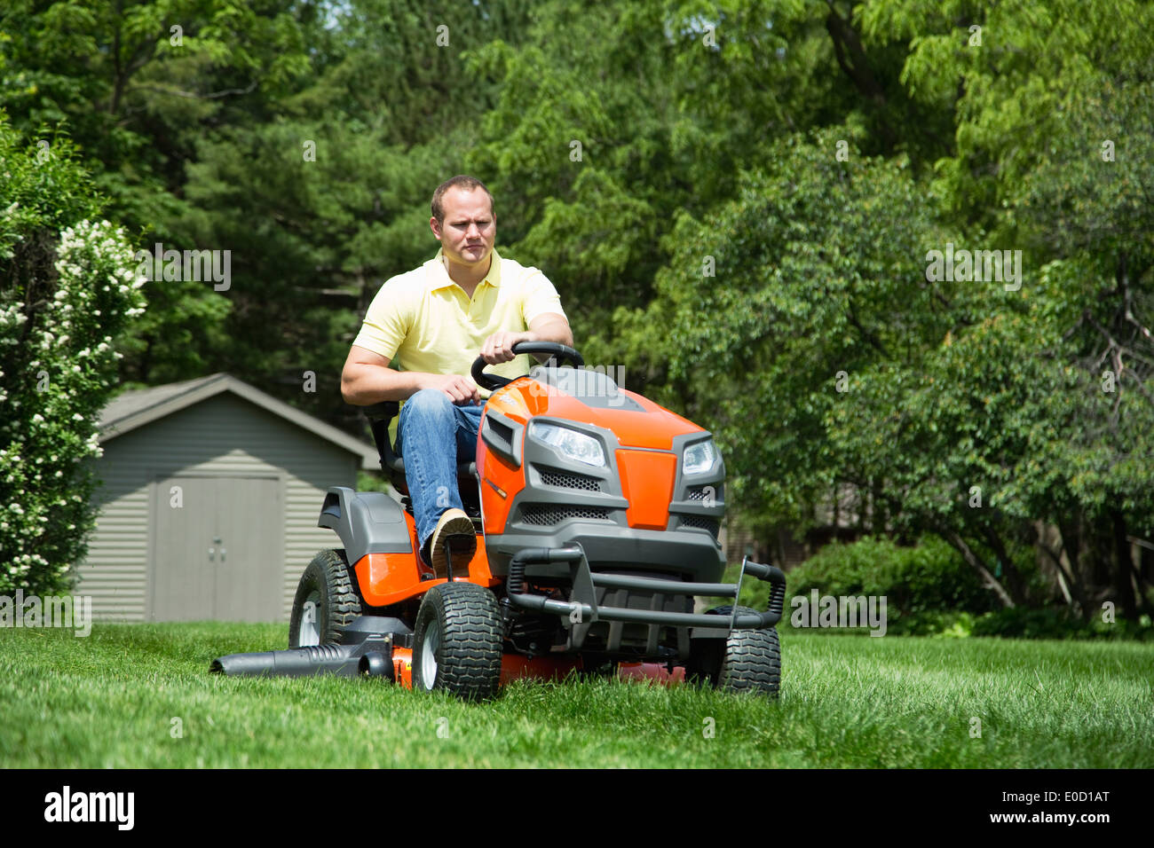 Man mowing lawn Stock Photo - Alamy