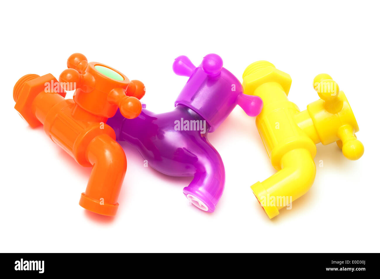 color plastic faucet on a white background Stock Photo - Alamy