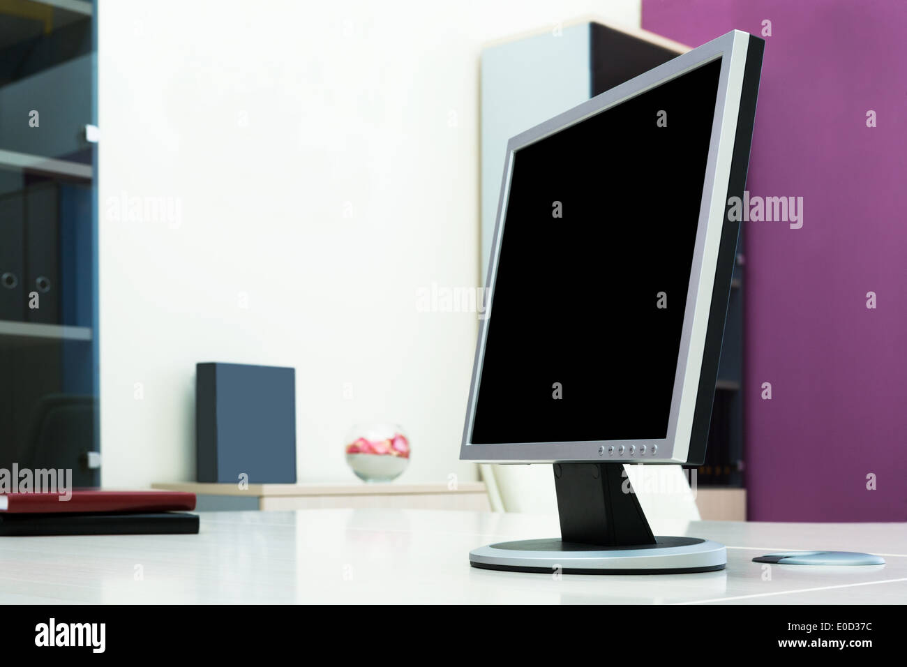 The monitor on a desk at modern office Stock Photo - Alamy
