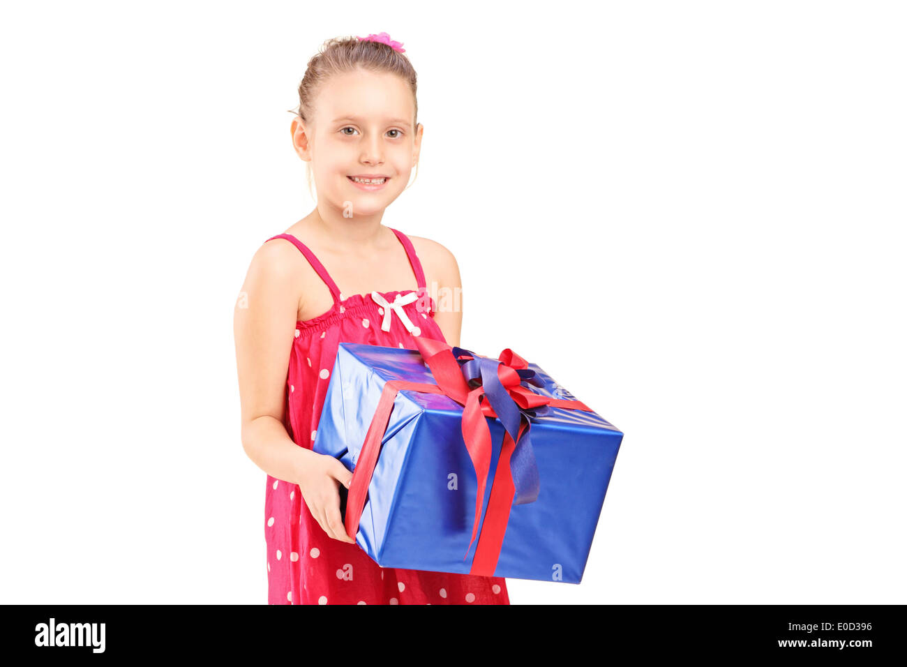 Young girl holding a wrapped present Stock Photo - Alamy