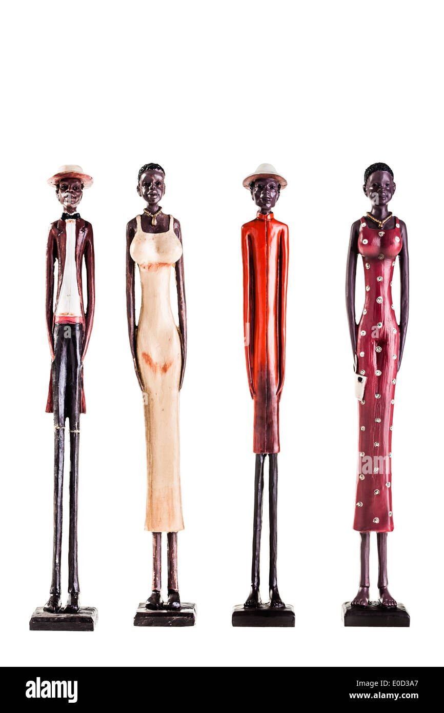 four statuettes depicting black people isolated over a white background ...