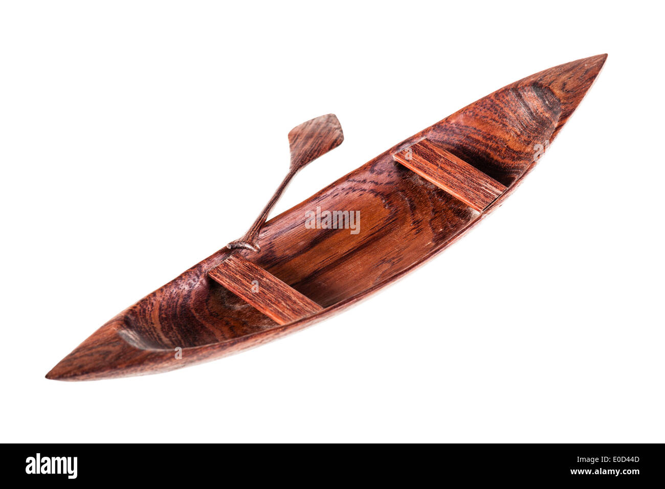 a wooden canoe model isolated over a white background Stock Photo - Alamy