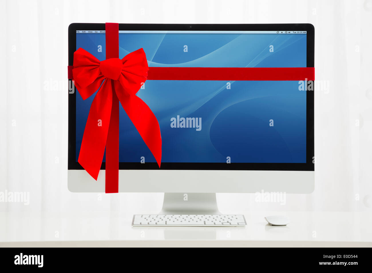 Computer with red bow Stock Photo - Alamy