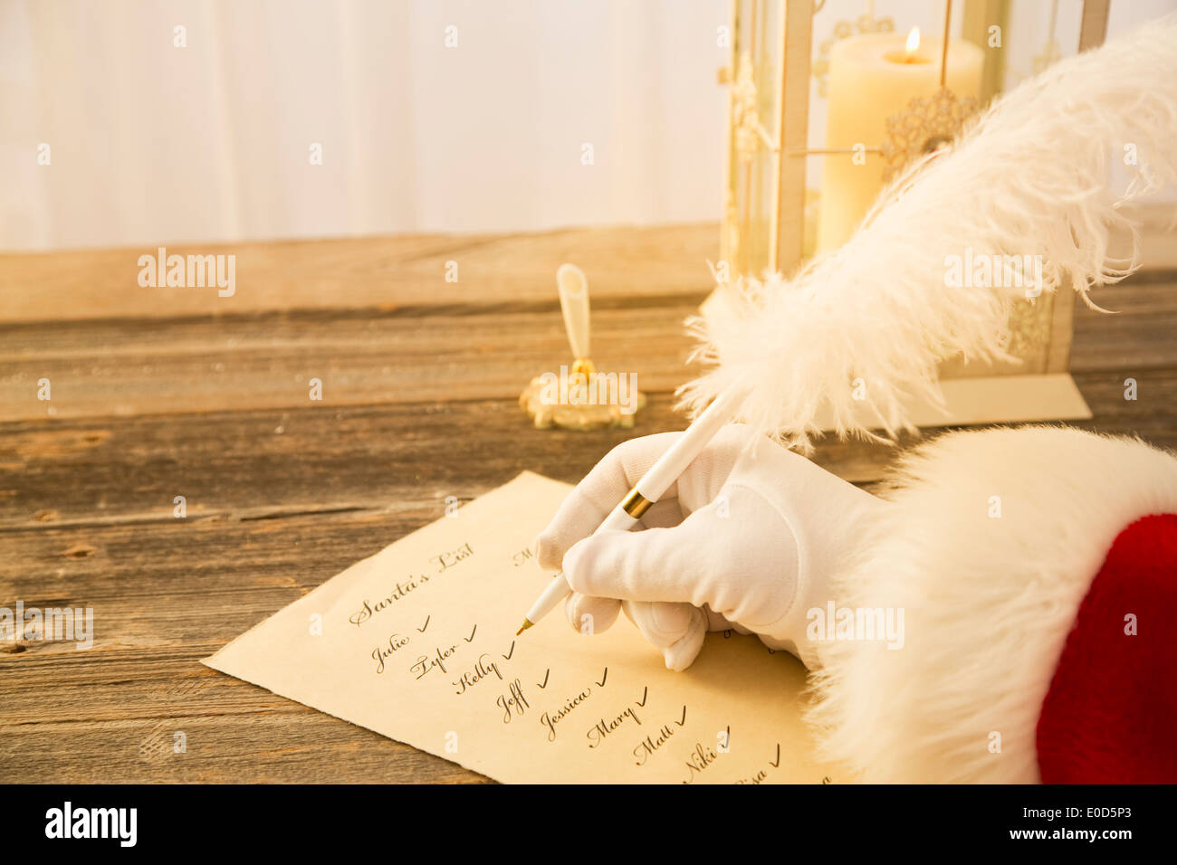 Santa Claus checking to do list Stock Photo - Alamy