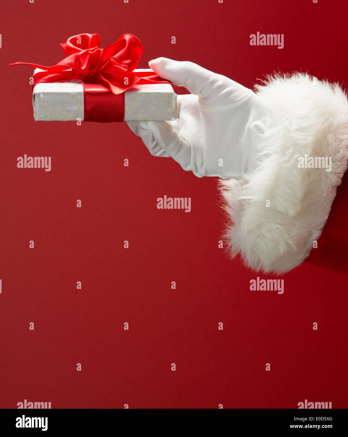 Santa giving gift hi-res stock photography and images - Alamy