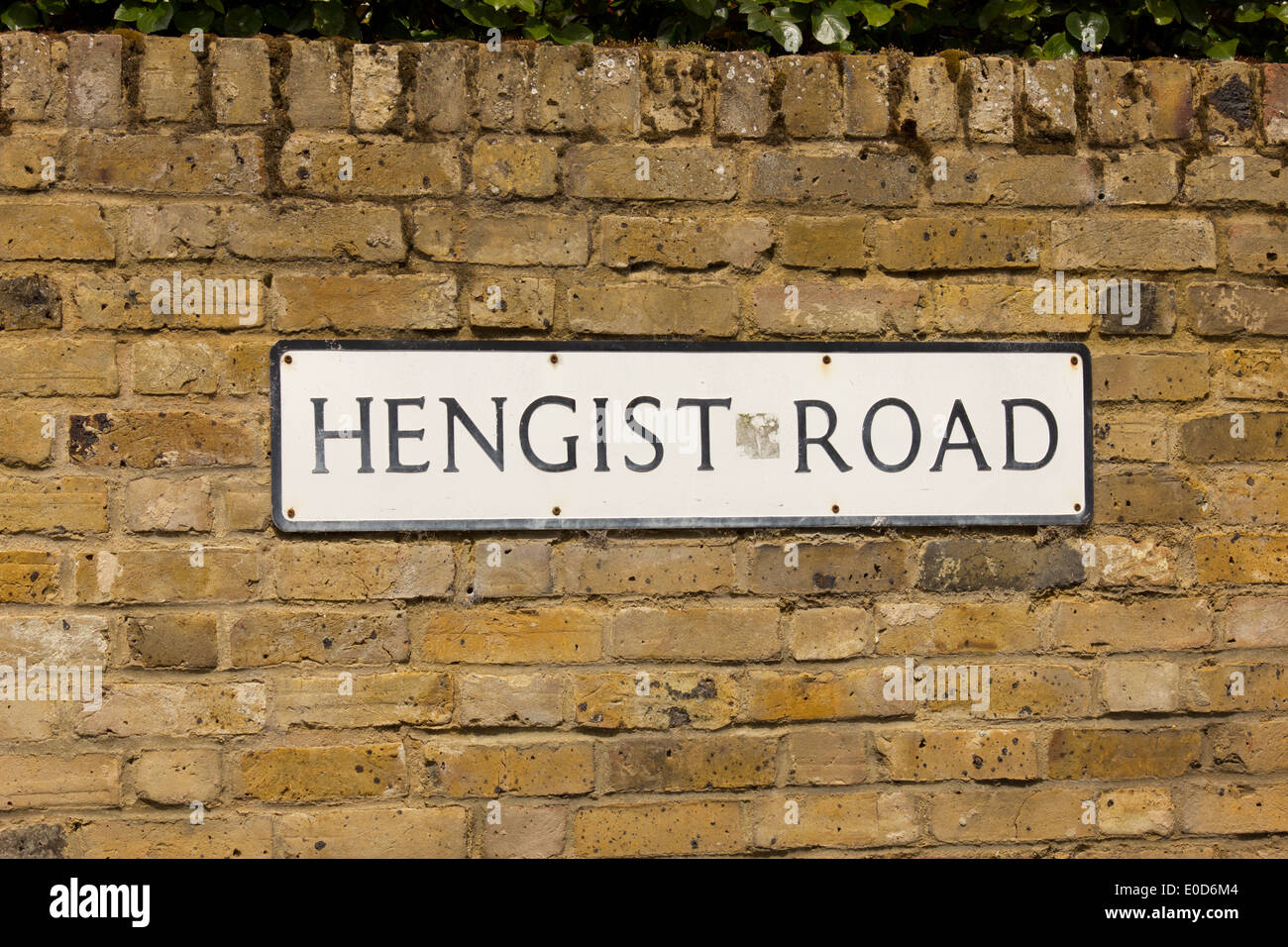 Road sign surrounded by Brick wall - Hengist Road Stock Photo - Alamy