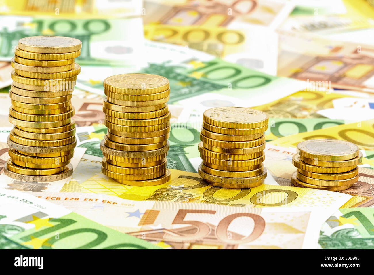 Pile of monetary coins, sinking curve, symbolic photo for falling ...