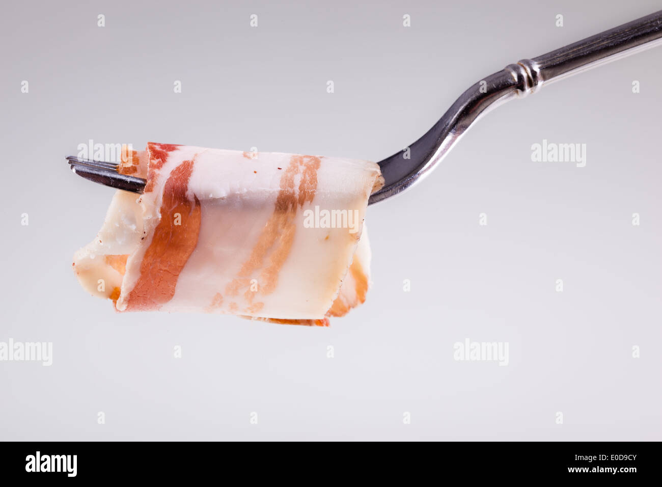 Rolled raw bacon slice hi-res stock photography and images - Alamy