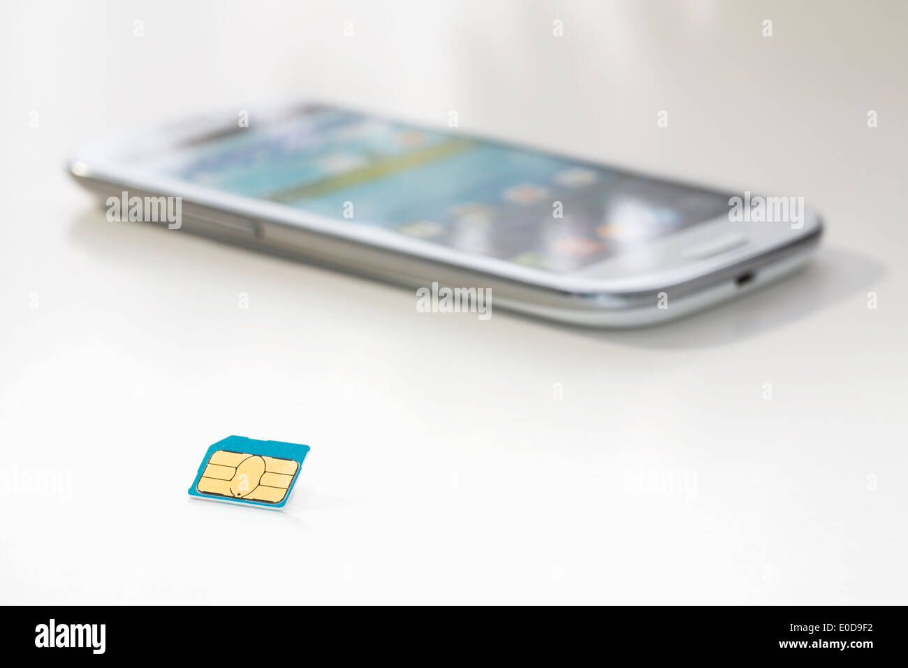 Cell phone with sim card Stock Photo - Alamy