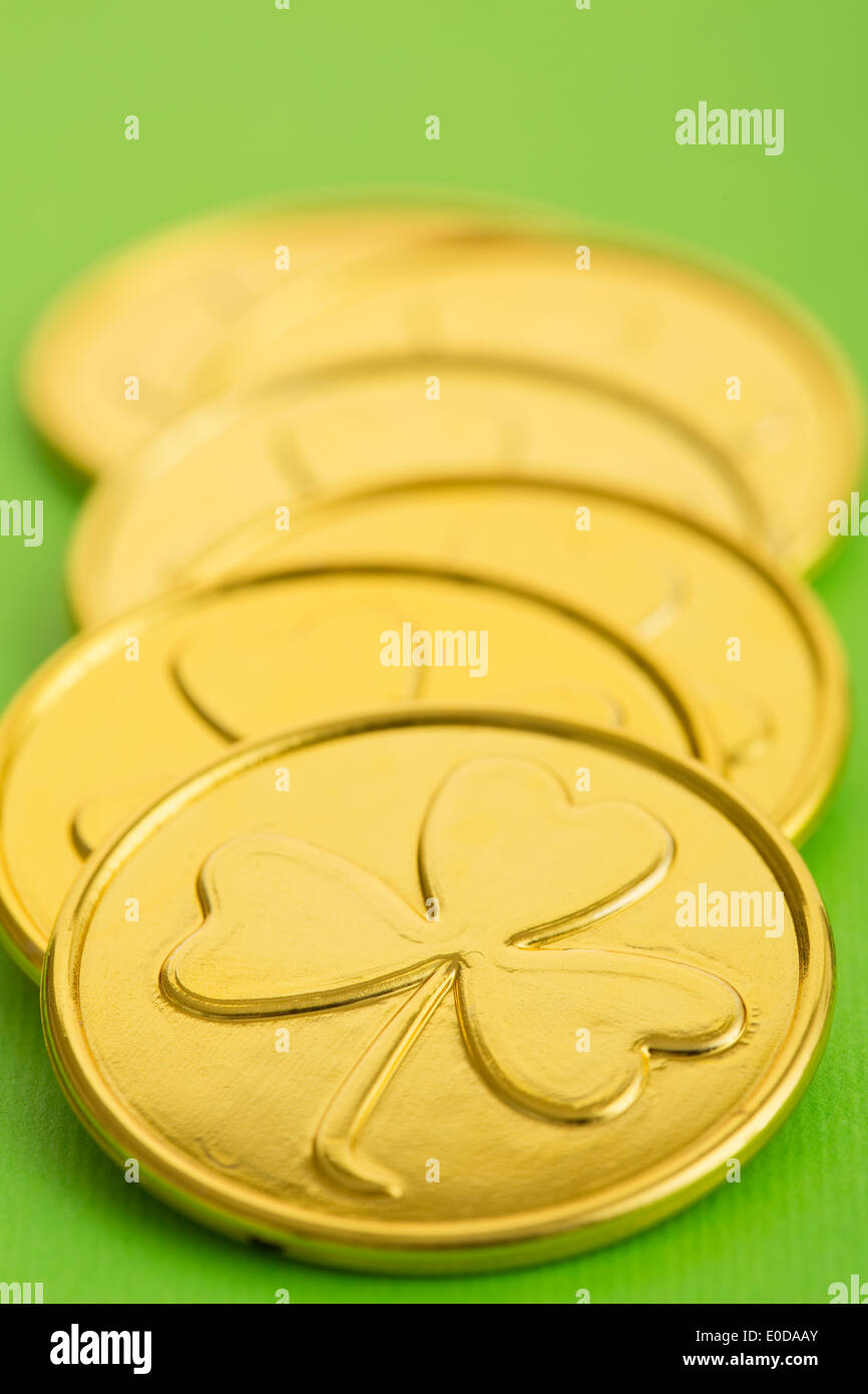Close up of gold coins with shamrock pattern Stock Photo - Alamy