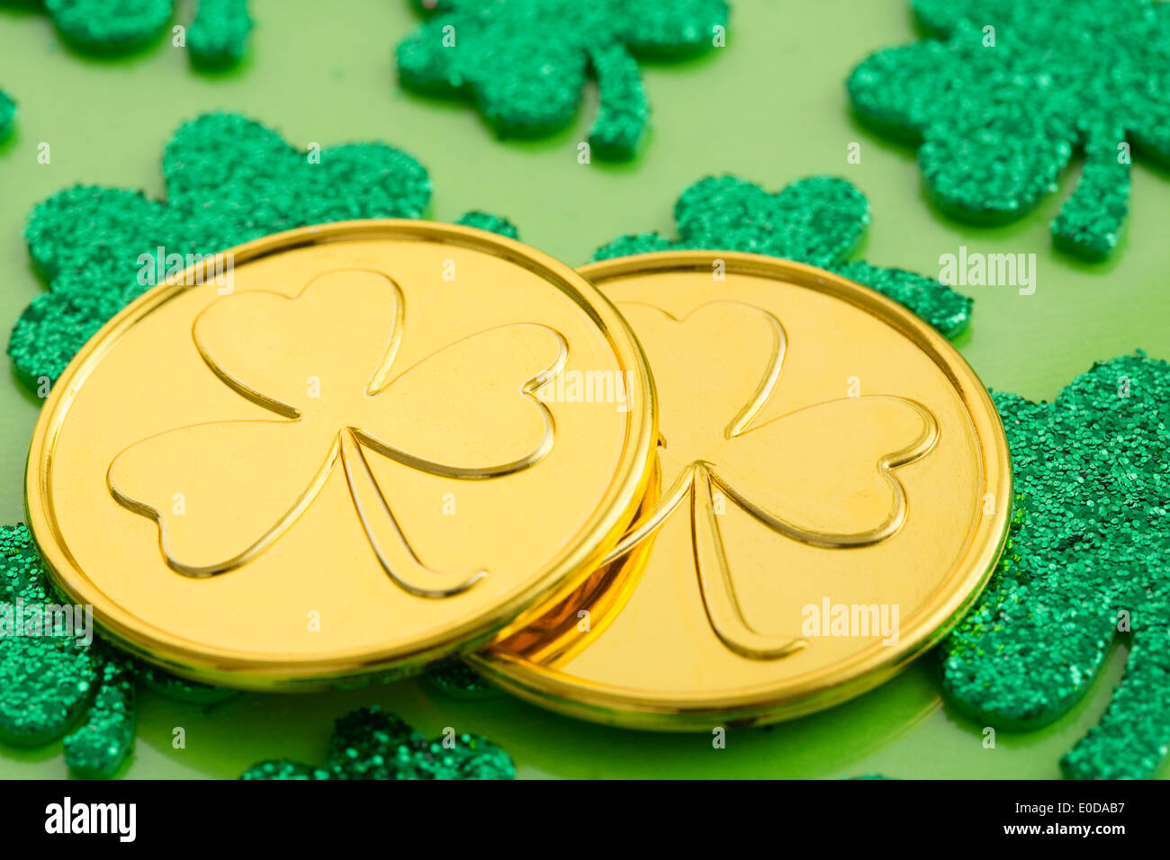 Close up of gold coins with shamrock pattern and shamrock below Stock ...