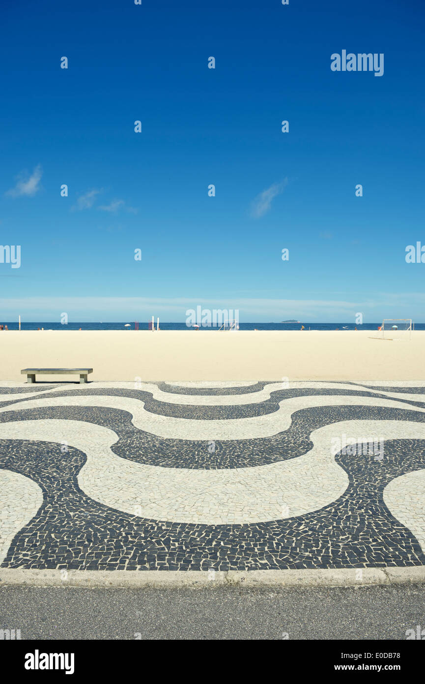 Iconic sidewalk tile pattern at empty view of Copacabana Beach Rio de ...