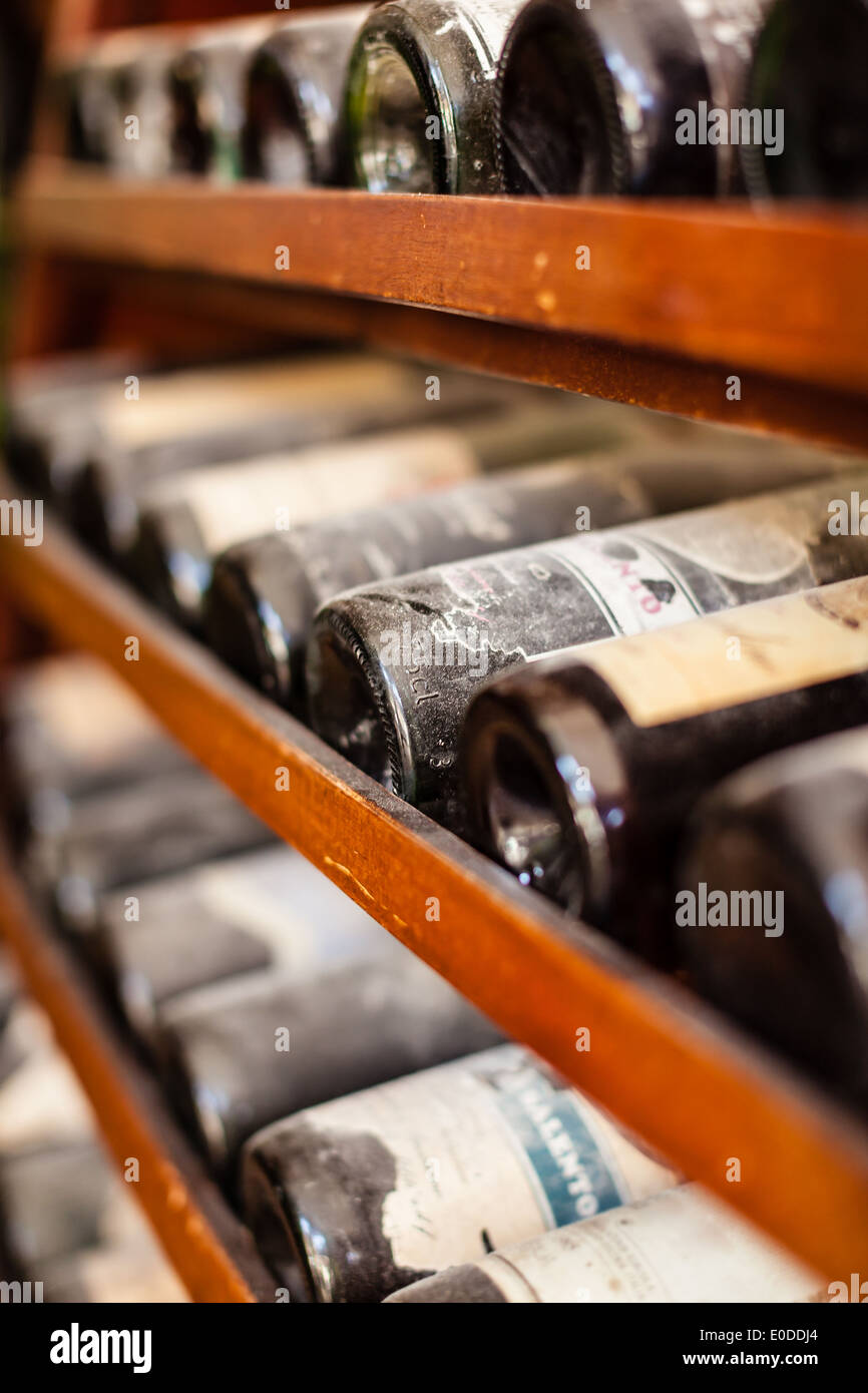 a lot of very old dusty wine bottles in an italian cellar Stock Photo ...