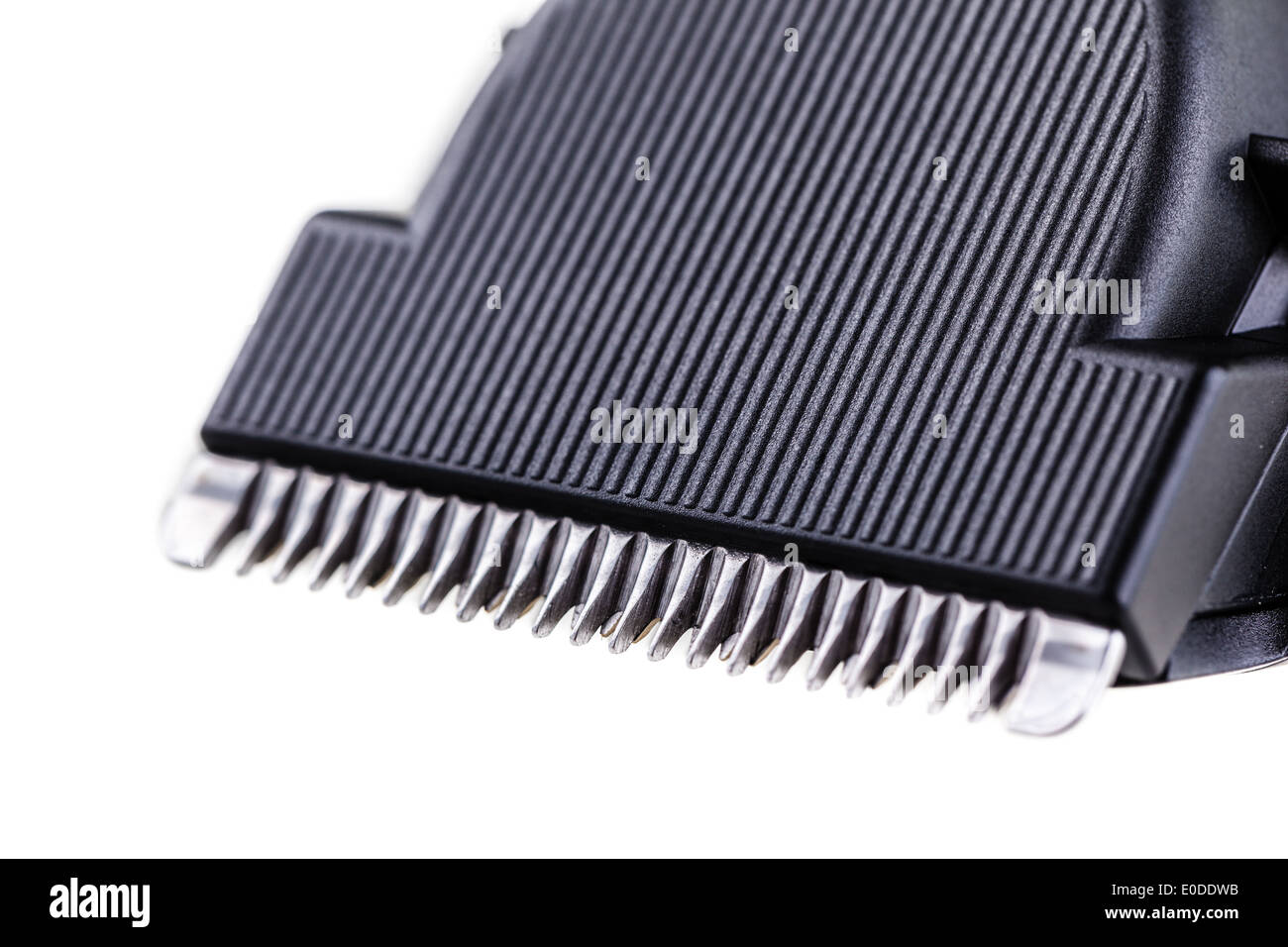 macro shot of a hair clipper head isolated over a white background ...