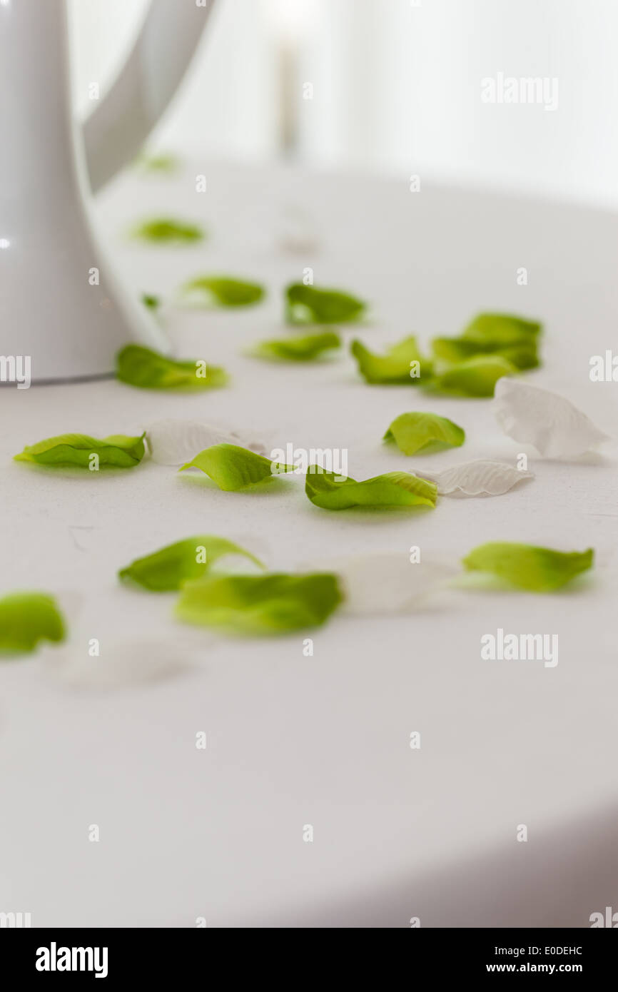 some flower petals scattered on a white table during a wedding Stock ...