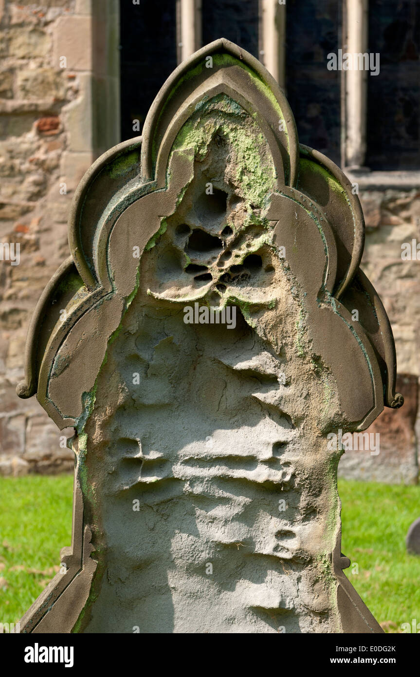Weathered gravestone, St. John the Baptist churchyard, Middleton ...
