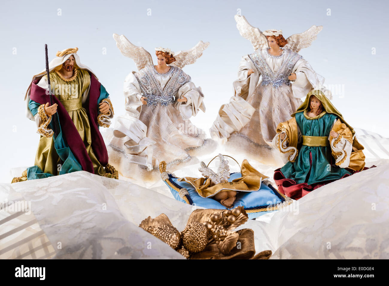 a very elegant crib with baby jesus, the virgin Mary, St. Joseph and ...