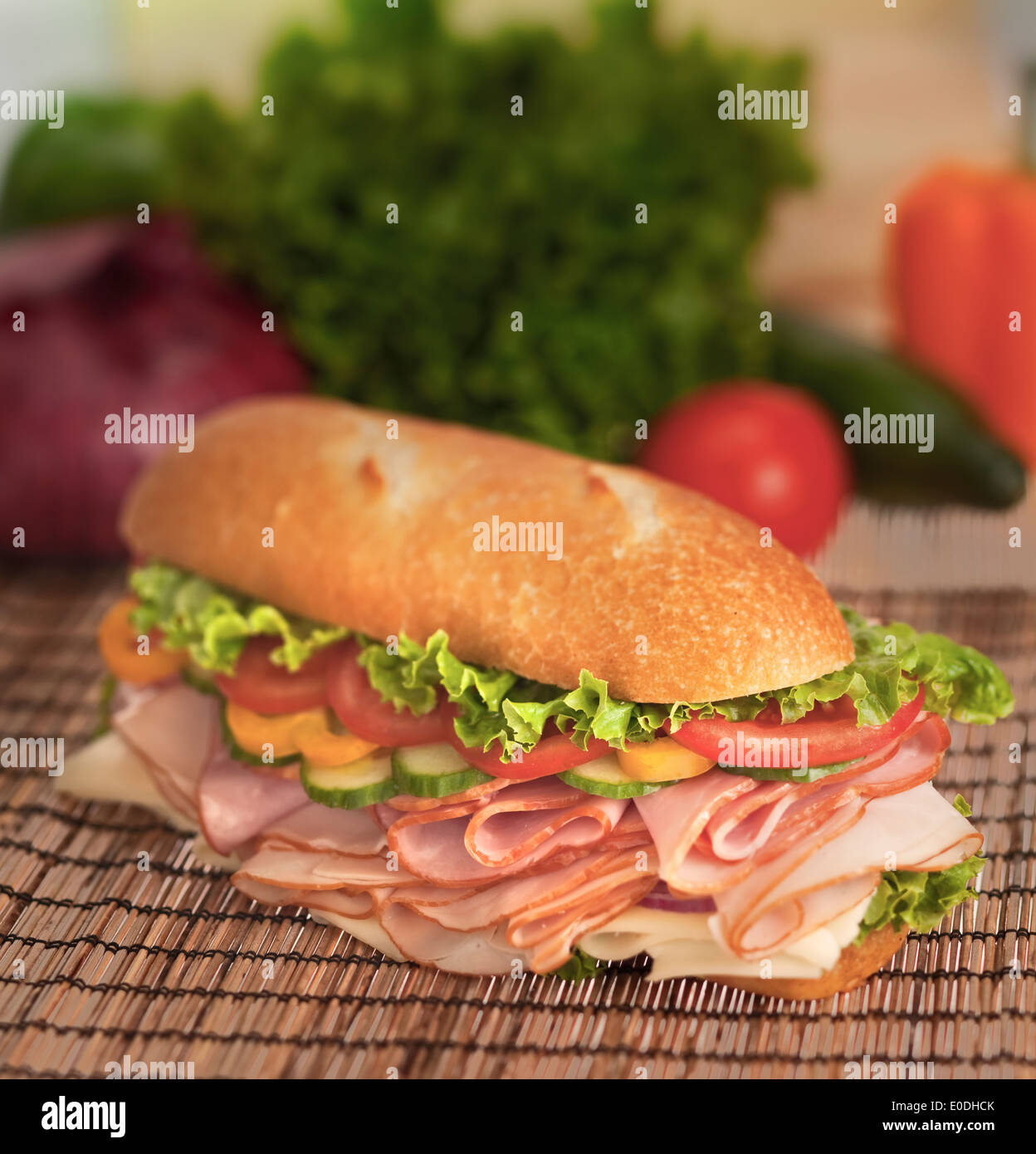 Loaded submarine sandwich with turkey, ham, cheese and fresh veggies ...