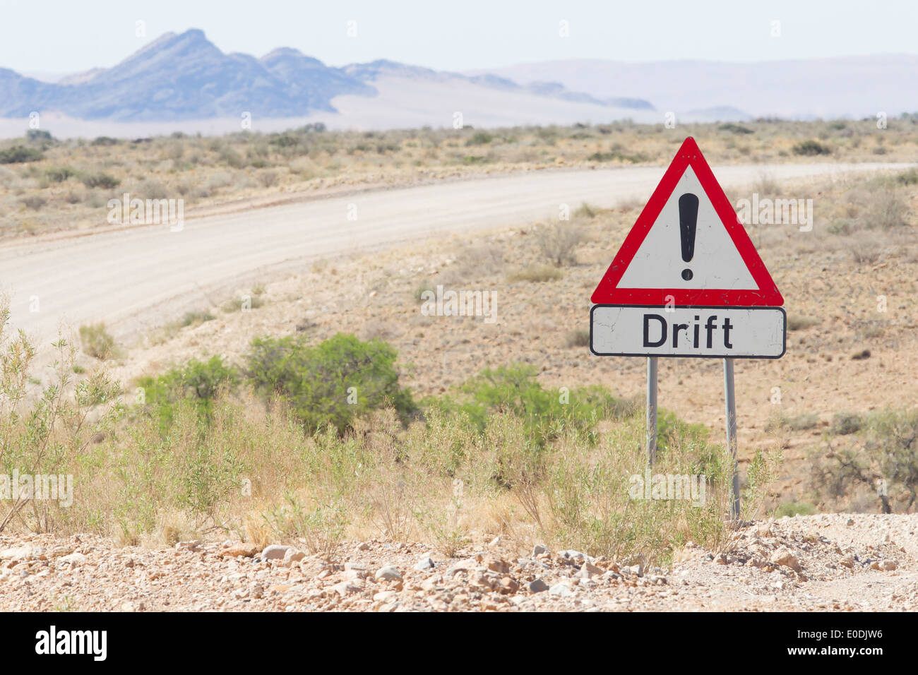 Drift warning sign at a gravel road in Namibia Stock Photo - Alamy
