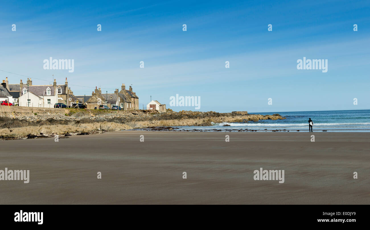 LONE SURFER ON THE BEACH AT SANDEND BANFFSHIRE COAST SCOTLAND Stock ...